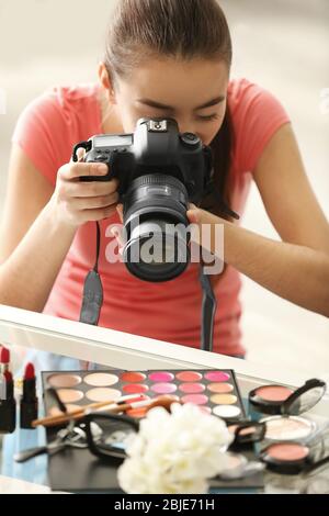 Creative woman shooting beauty products for commercials. Professional ...