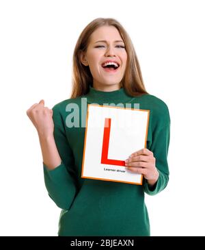 Young woman with learner driver sign on white background Stock Photo ...