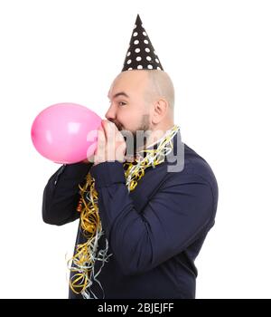 Funny fat man inflating balloon at birthday party Stock Photo - Alamy