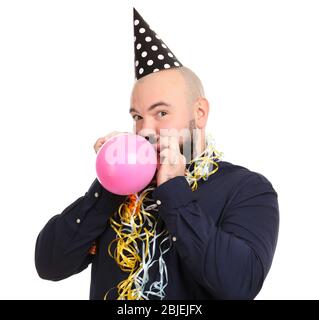 Funny fat man inflating balloon at birthday party Stock Photo - Alamy