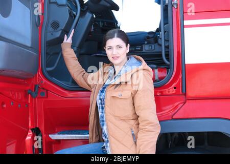 Female driver near big modern truck outdoors Stock Photo - Alamy