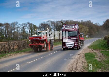 Road traffic slow moving tractor agricultural vehicle on the main A75 ...