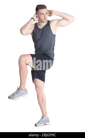 Handsome man doing bicycle crunch on white background Stock Photo - Alamy