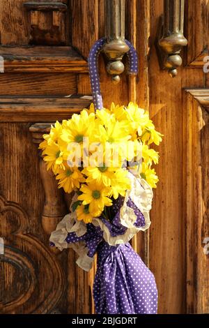 Umbrella with lilac flowers hanging on brick wall, closeup Stock Photo ...