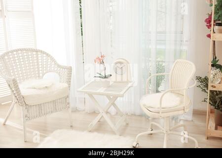 Beautiful modern veranda with cozy armchairs and coffee table Stock ...