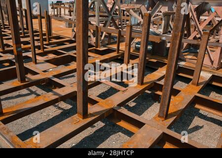 Metal supports for vessels in dockyard Stock Photo - Alamy
