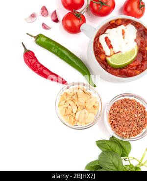 Composition with delicious turkey chili and ingredients on white ...