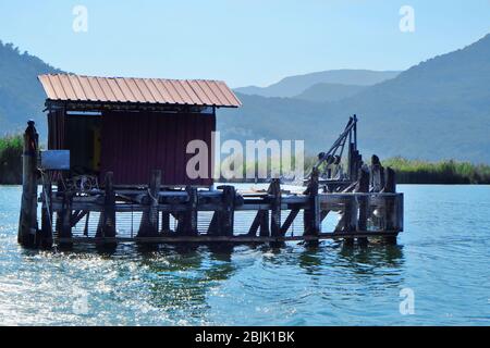 Fencing of fish farm on river Stock Photo - Alamy