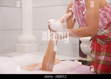 Turkish hammam spa procedure. Foam peeling massage for body Stock Photo ...