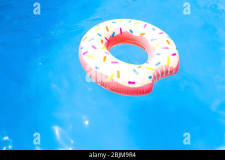 Rubber Lilo floating in a swimming pool Stock Photo - Alamy