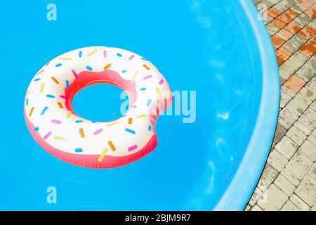 Rubber Lilo floating in a swimming pool Stock Photo - Alamy