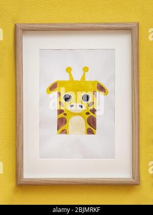 Yellow Giraffe on yellow wall Stock Photo - Alamy