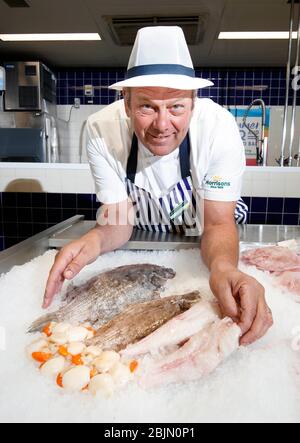 EDITORIAL USE ONLY Morrisons' Fishmonger Andrew Speight prepares whole ...
