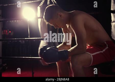 Professional boxer having break during training Stock Photo - Alamy