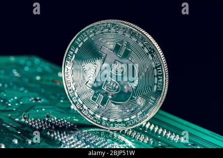 golden bitcoin and computer chip in background Stock Photo - Alamy