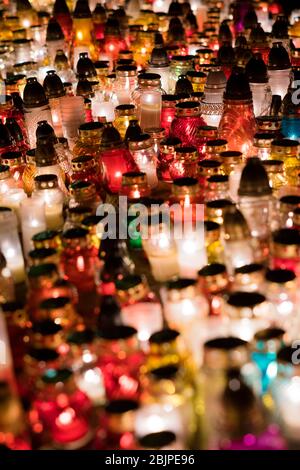 Flowers and candles on a colorful polish cemetery. Autumn, preparations ...