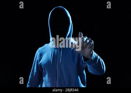 Hacker pushing button on virtual screen against white background Stock ...