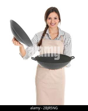 Housewife holding a wok pan on gray background Stock Photo - Alamy