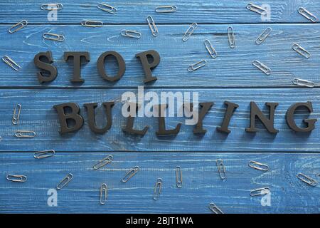 Text "Stop bullying" on wooden background Stock Photo - Alamy