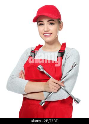 Female auto mechanic with lug wrench on white background Stock Photo ...
