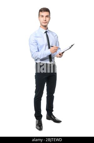 Handsome car salesman writing on clipboard against white background ...