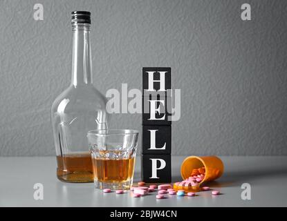 Drugs word on Wooden cubes on a wooden table. Keather wallet. Wasting ...