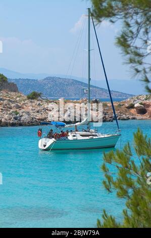 Agistri island Aponisos beach destination Greece. Blur rocky beach sea ...