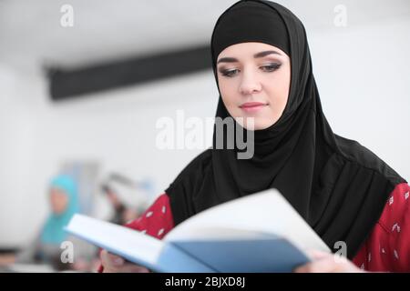 Muslim student wearing traditional clothes in classroom Stock Photo - Alamy