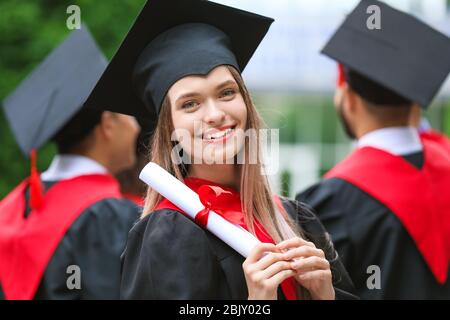 Female student in bachelor robe on her graduation day Stock Photo - Alamy