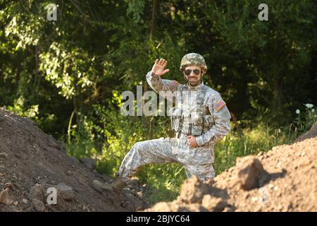 Male soldier in fighting position, back view Stock Photo - Alamy