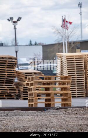 Wooden pallets in factory Stock Photo - Alamy