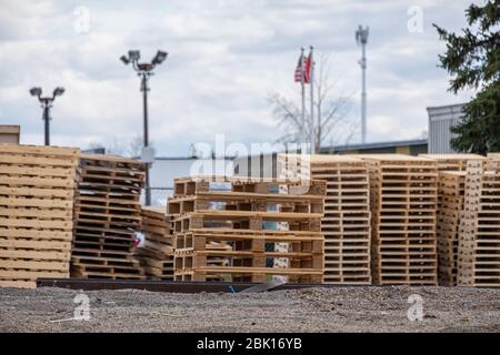 Stacks of wood pallets in a factory Stock Photo - Alamy