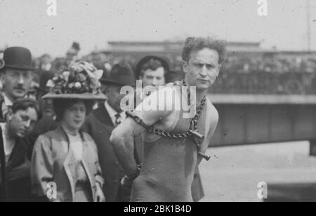 Houdini jumps from Harvard Bridge, 1908, Houdini standing by the side ...