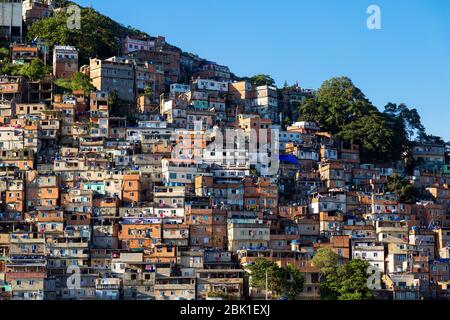 Aerial view of crowded favela housing contrasts with modern apartment ...