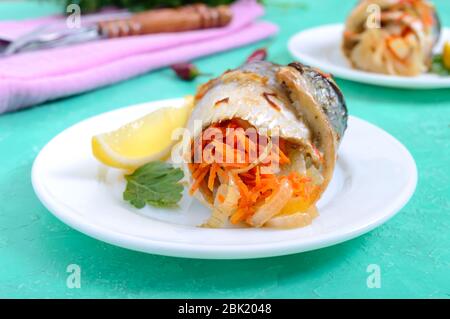 Baked herring stuffed with vegetables. Tasty fish rolls Stock Photo - Alamy
