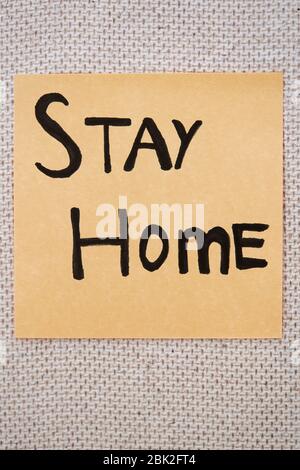 Social notice board with message stay at home Stock Photo - Alamy