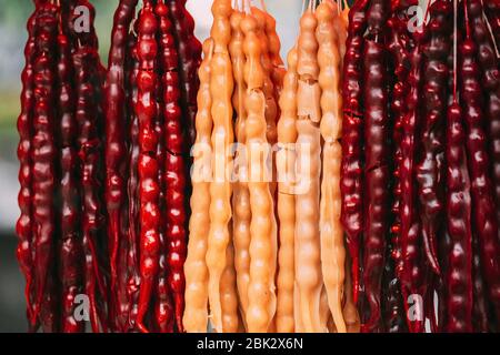 Traditional Georgian food sausage-shaped candy churchkhela hanging in ...