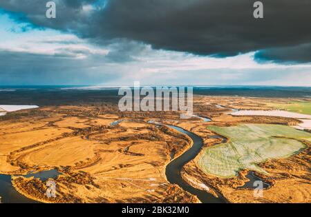 Top drone view of curved river. Scenic winter landscape. Forest and ...