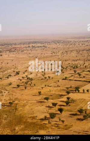 Aerial view of the dry Sub-Saharan landscapes with fields and the Niger ...