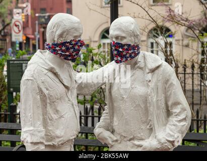 Statues of Gay Liberation Monument wearing protective facial bandanas ...