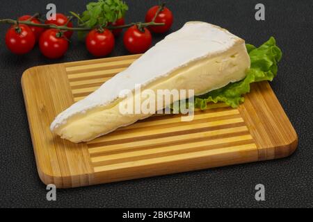 Brie cheese triangle served salad leaves Stock Photo - Alamy