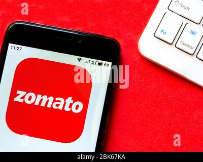 In this photo illustration, the Zomato logo seen displayed on a ...