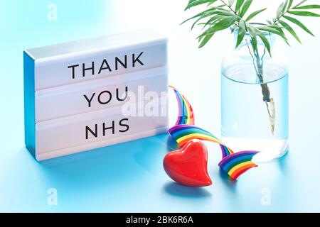 Heart, rainbow ribbon, symbols of public support for doctors, nurses ...