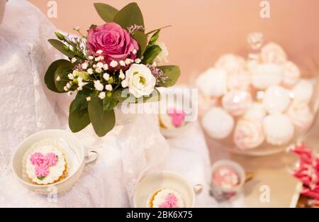 Photo of a Wedding set of biscuits in pink colour Stock Photo - Alamy