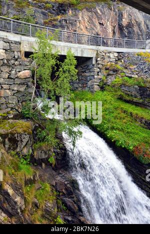 The Ljoelva River cascades down the mountainside at the Geirangerfjord ...