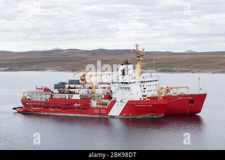 Red Canadian Coast Guard ship Sir William Alexander sailing in harbour ...