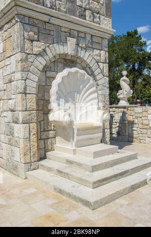 Empty cement throne in shape of a shell, seat, ancient decorative ...