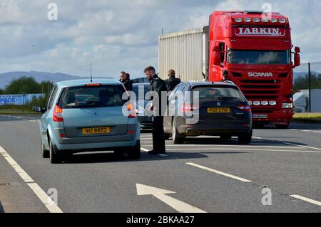 PSNI officers pictured at a vehicle checkpoint, engaging the public on ...