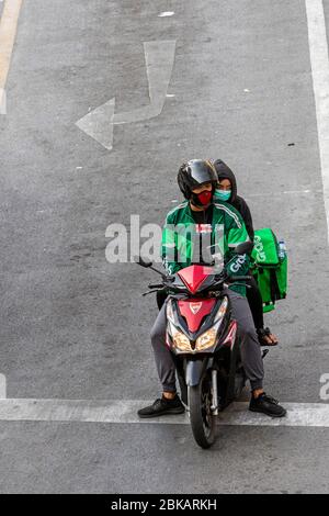 Grab motorcycle rider with face mask during Covid pandemic, Bangkok ...