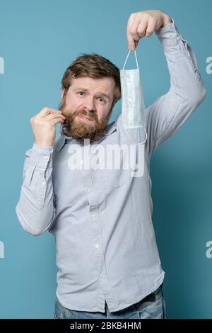 Covid-19 and lifestyle concept. Confused girl in face mask looking at ...